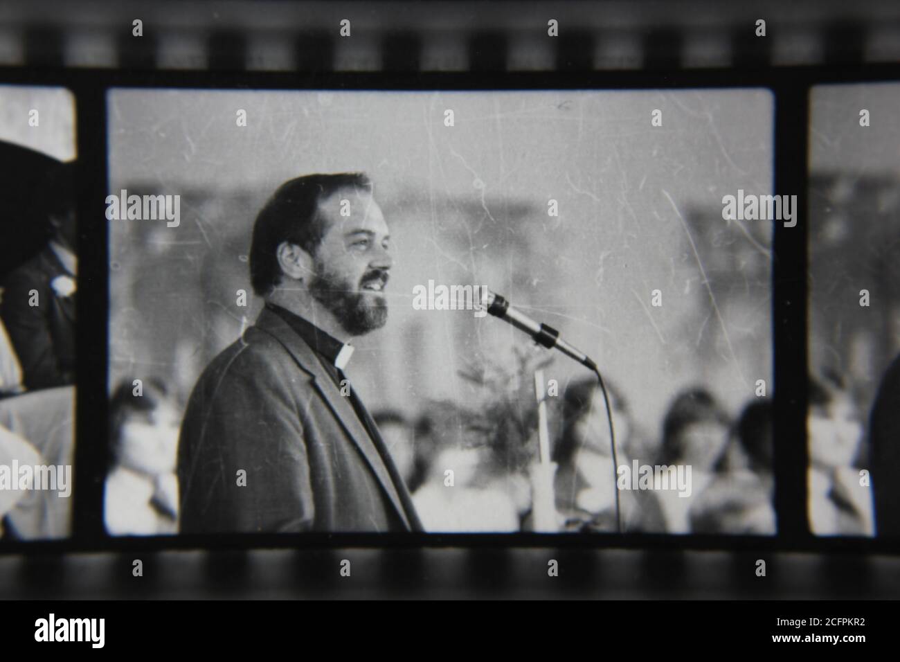 Fine 1970s vintage black and white photography of a priest speaking in ...
