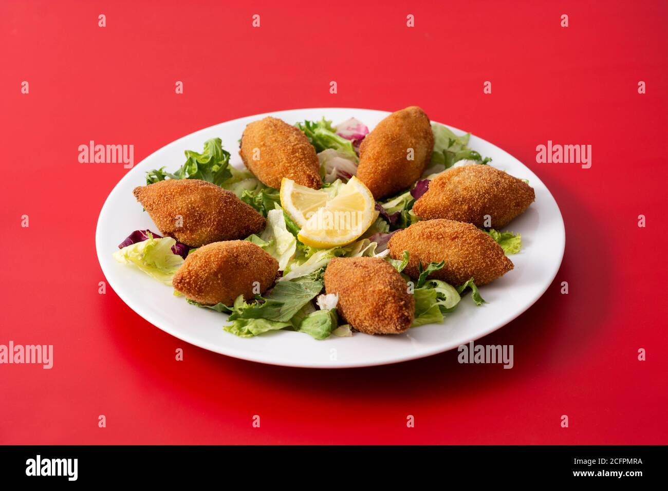 Traditional lebanese kibbeh on red background Stock Photo - Alamy
