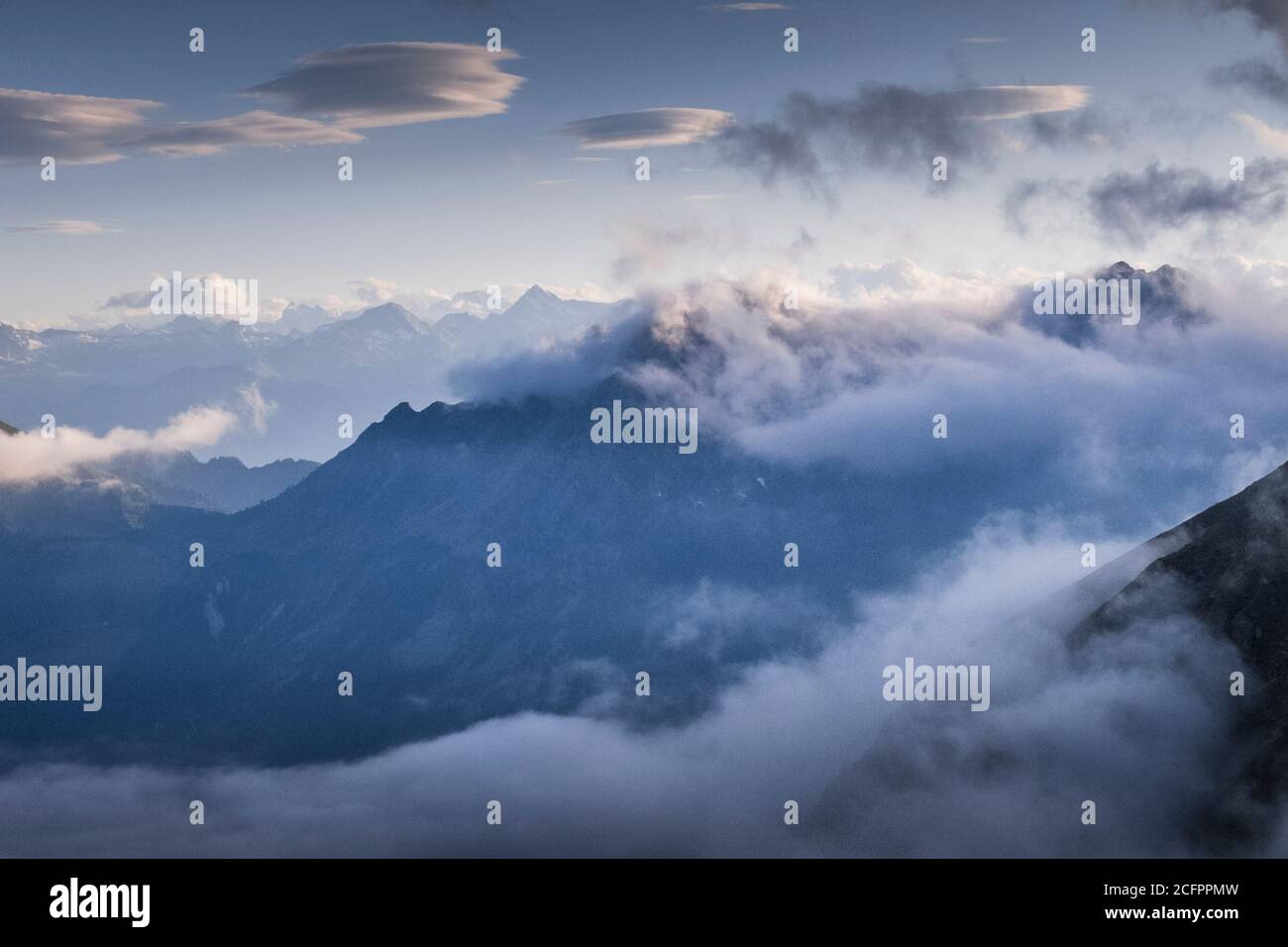 Clouds and wonderful lights in the Italian Alps Stock Photo - Alamy