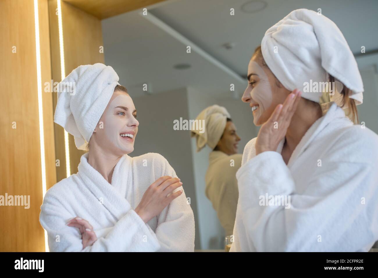 Young women having beauty spa day together and feeling good Stock Photo ...