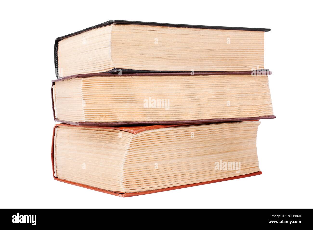 Three closed old thick paper books with yellow pages white background ...