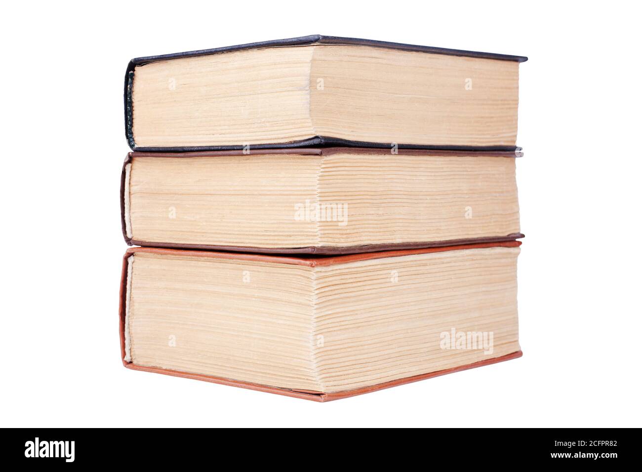 Three closed old thick paper books with yellow pages white background ...