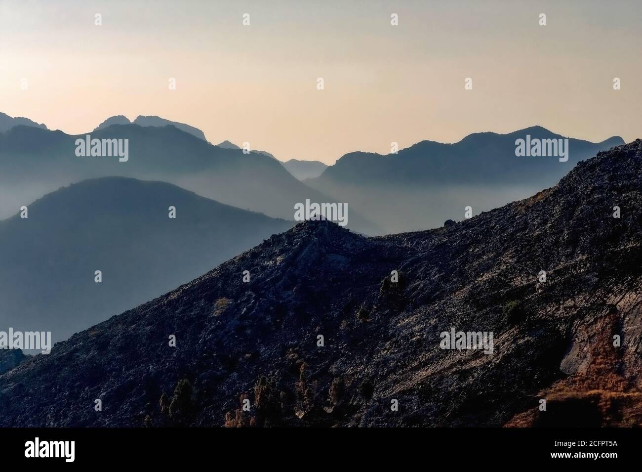 Approaching sunset paints the rugged landscape beyond Lago Rosamarina ...