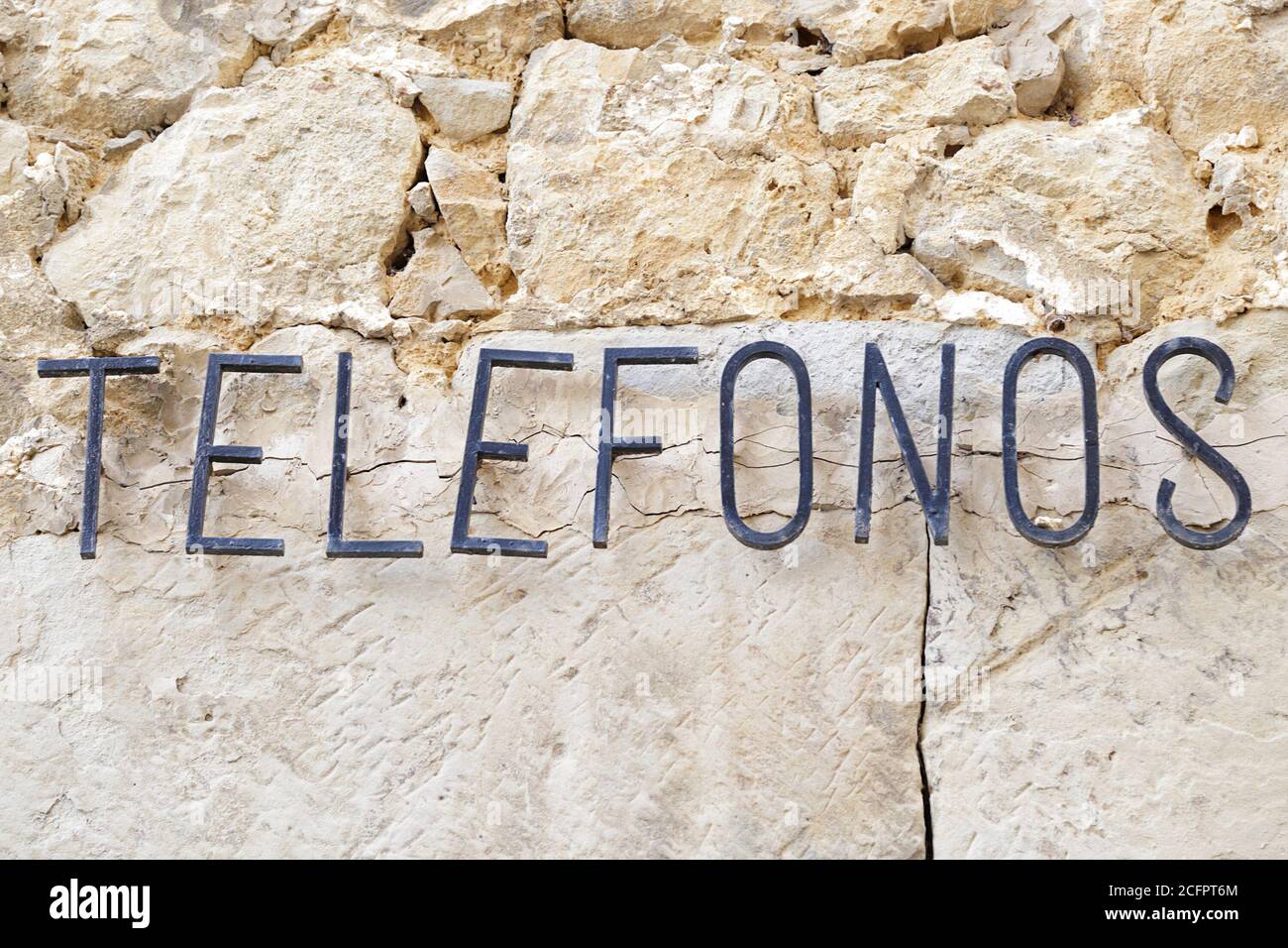 Old sign with the word telephone written in Spanish Stock Photo - Alamy