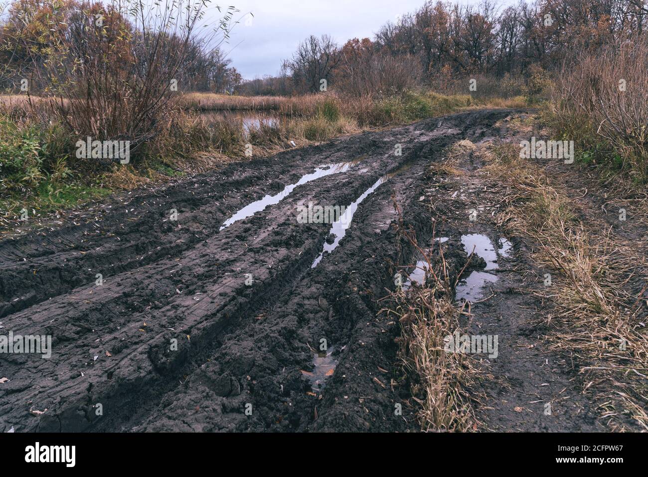 Deep ruts in the slushy autumn road Stock Photo - Alamy
