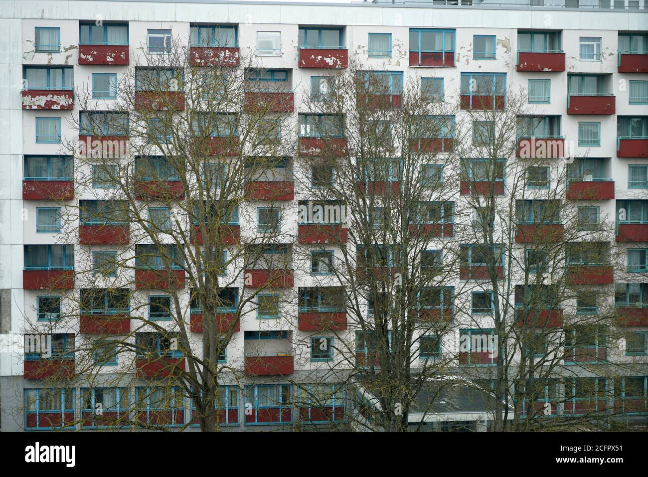 Residential building seen through trees Stock Photo - Alamy