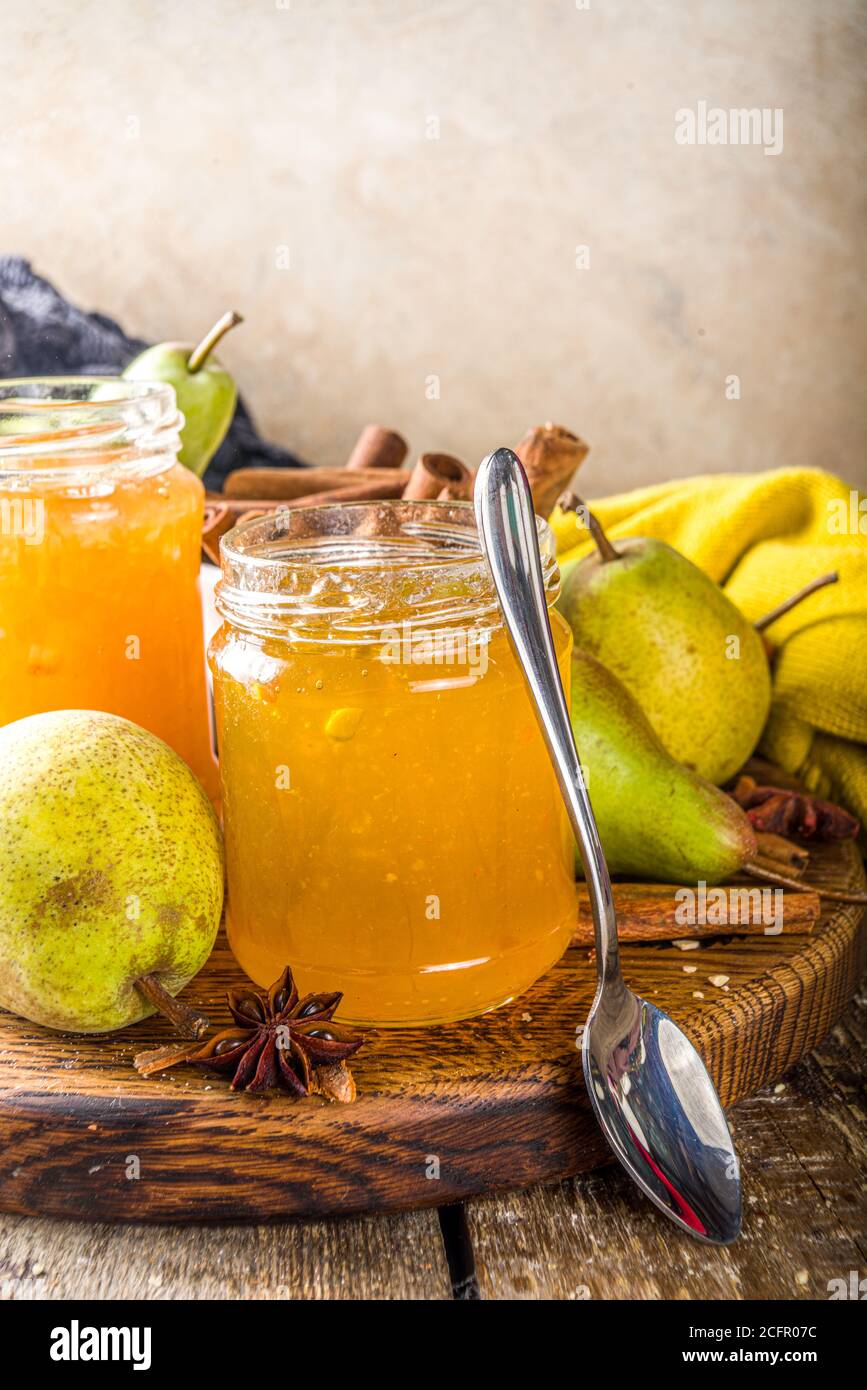 Homemade sweet and spicy pear jam. Different glass jars with pear jam ...