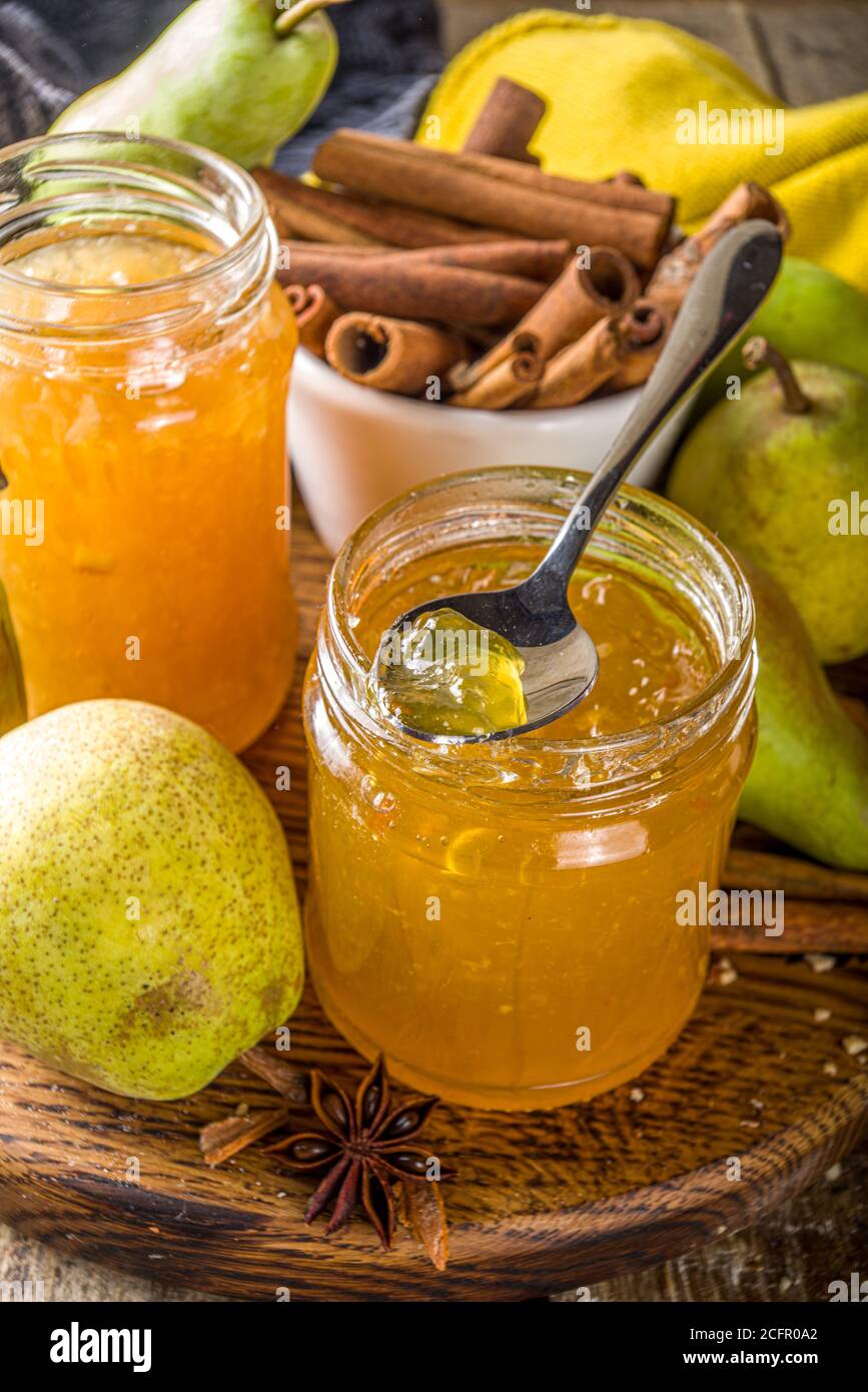 Homemade sweet and spicy pear jam. Different glass jars with pear jam ...