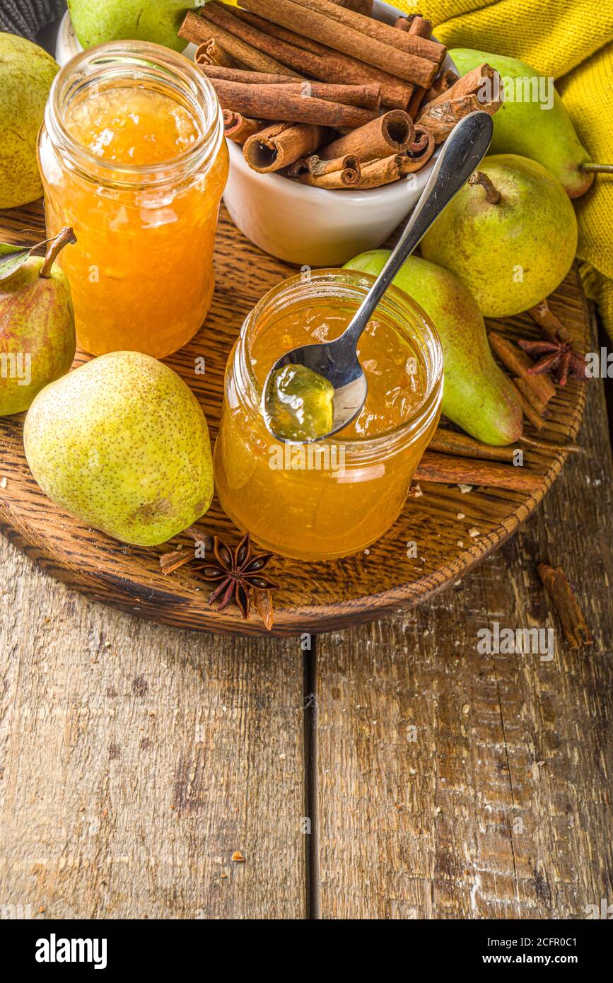 Homemade sweet and spicy pear jam. Different glass jars with pear jam ...