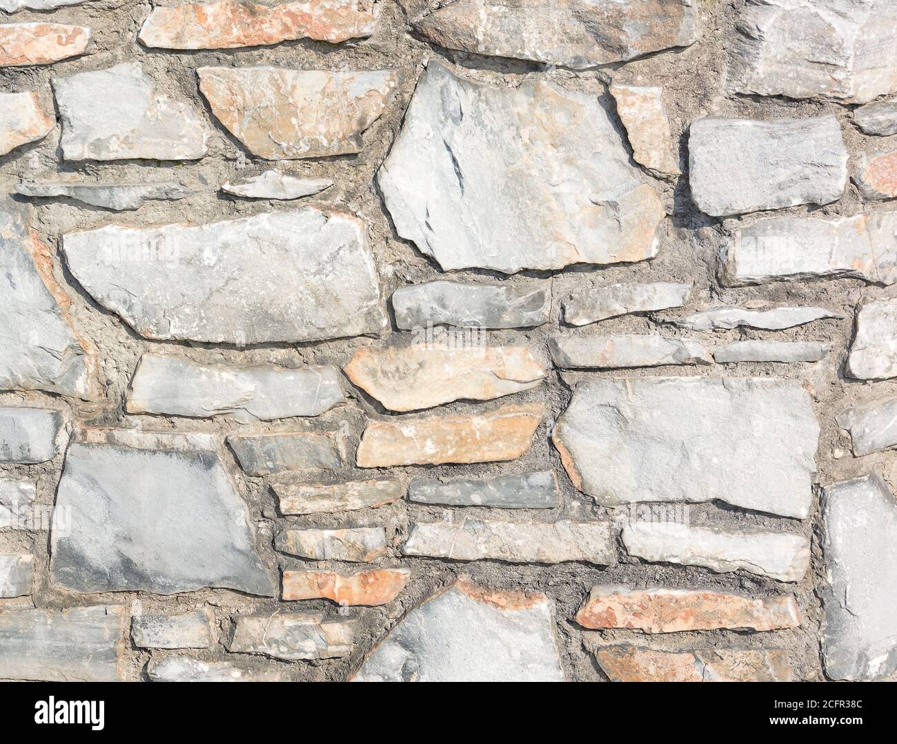 Background with masonry of stones of irregular shape in gray Stock ...