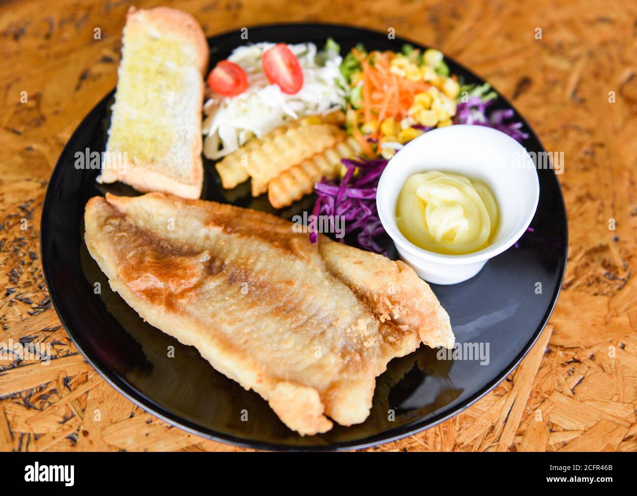 fried fish fillet / Fish dish steak fish with sauce cream french fries ...