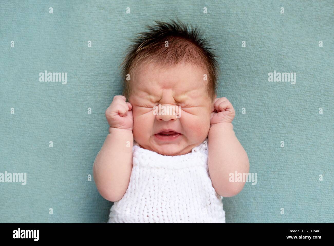 portrait of crying newborn baby. emotions of discontent. colic Stock ...