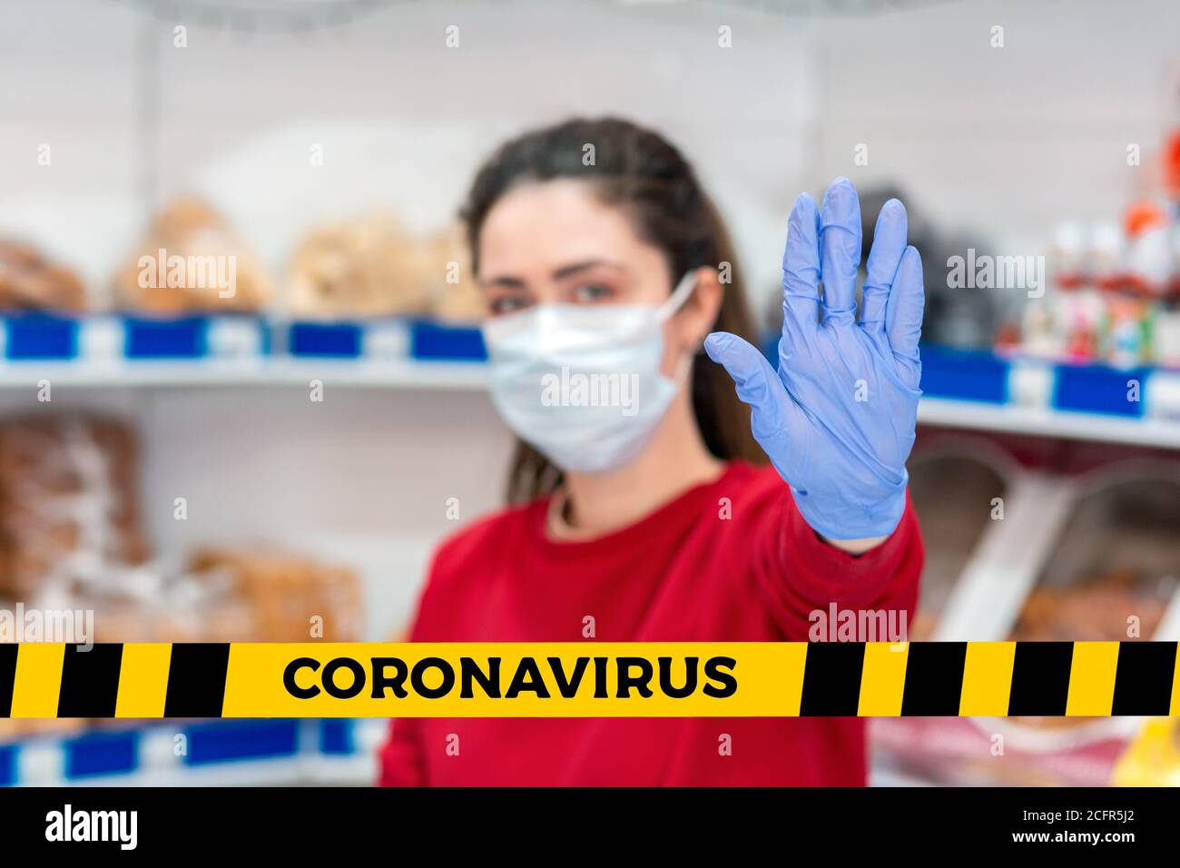 Do not cross.Barrier tape-quarantine,isolation.A woman in rubber gloves ...