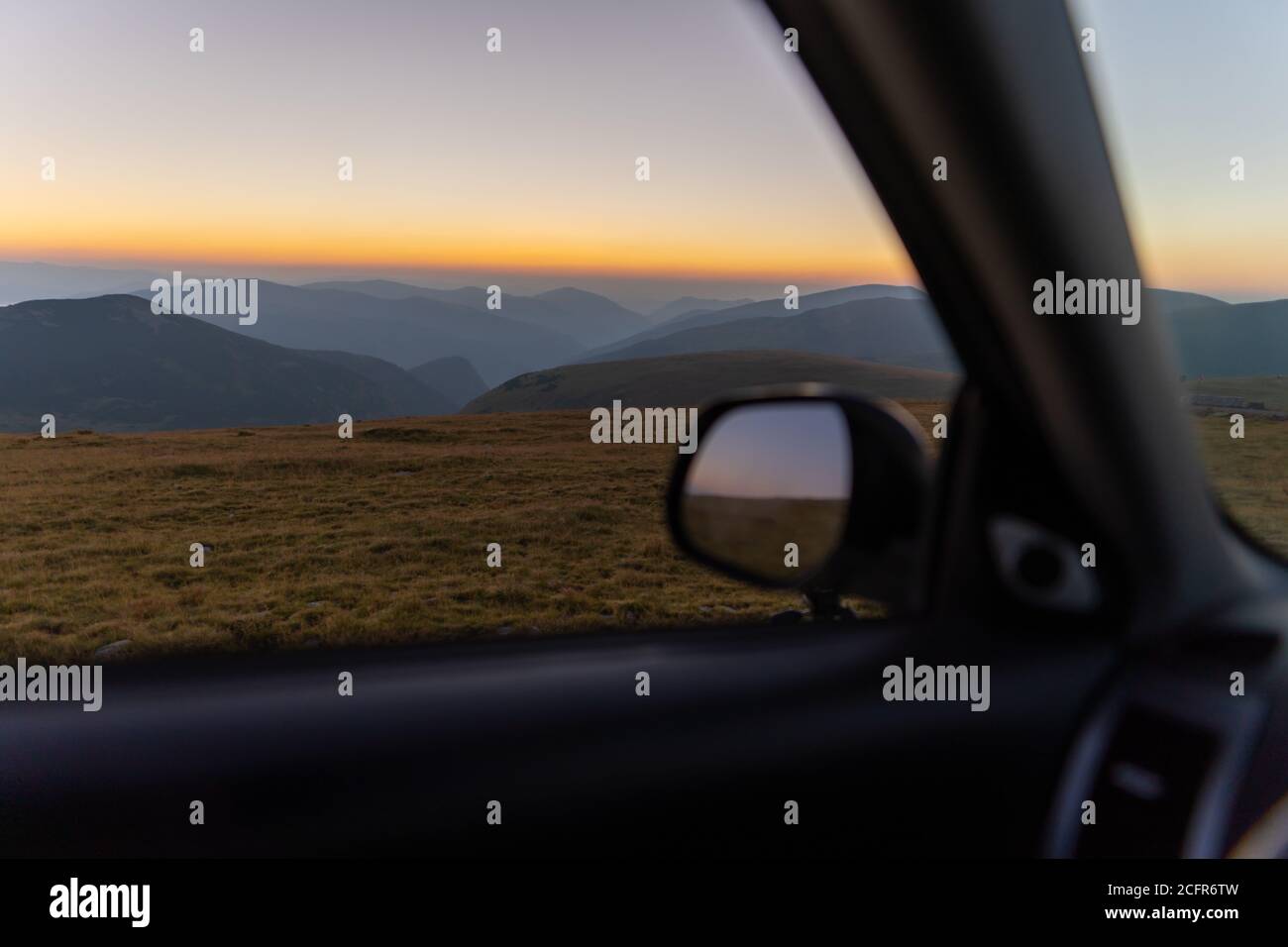 Sunrise - driver's view from car window in the mountains, off-road ...