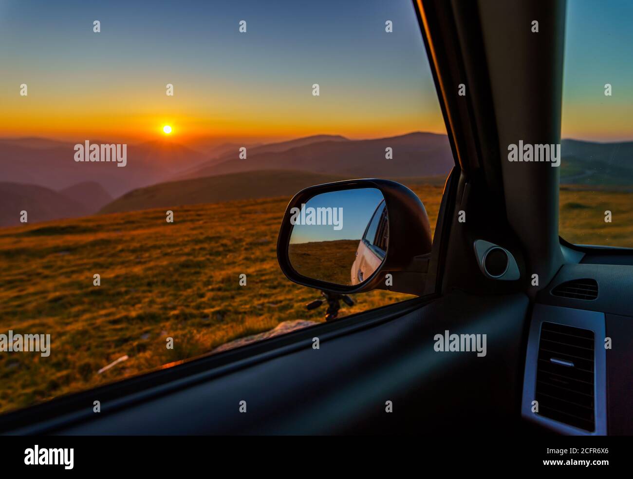 Sunrise - driver's view from car window in the mountains, off-road ...