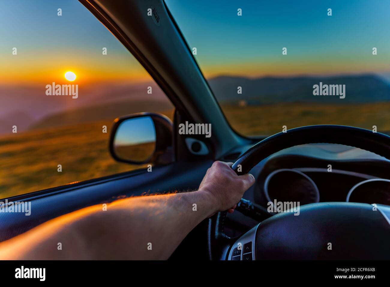 Sunrise - driver's view from car window in the mountains, off-road ...