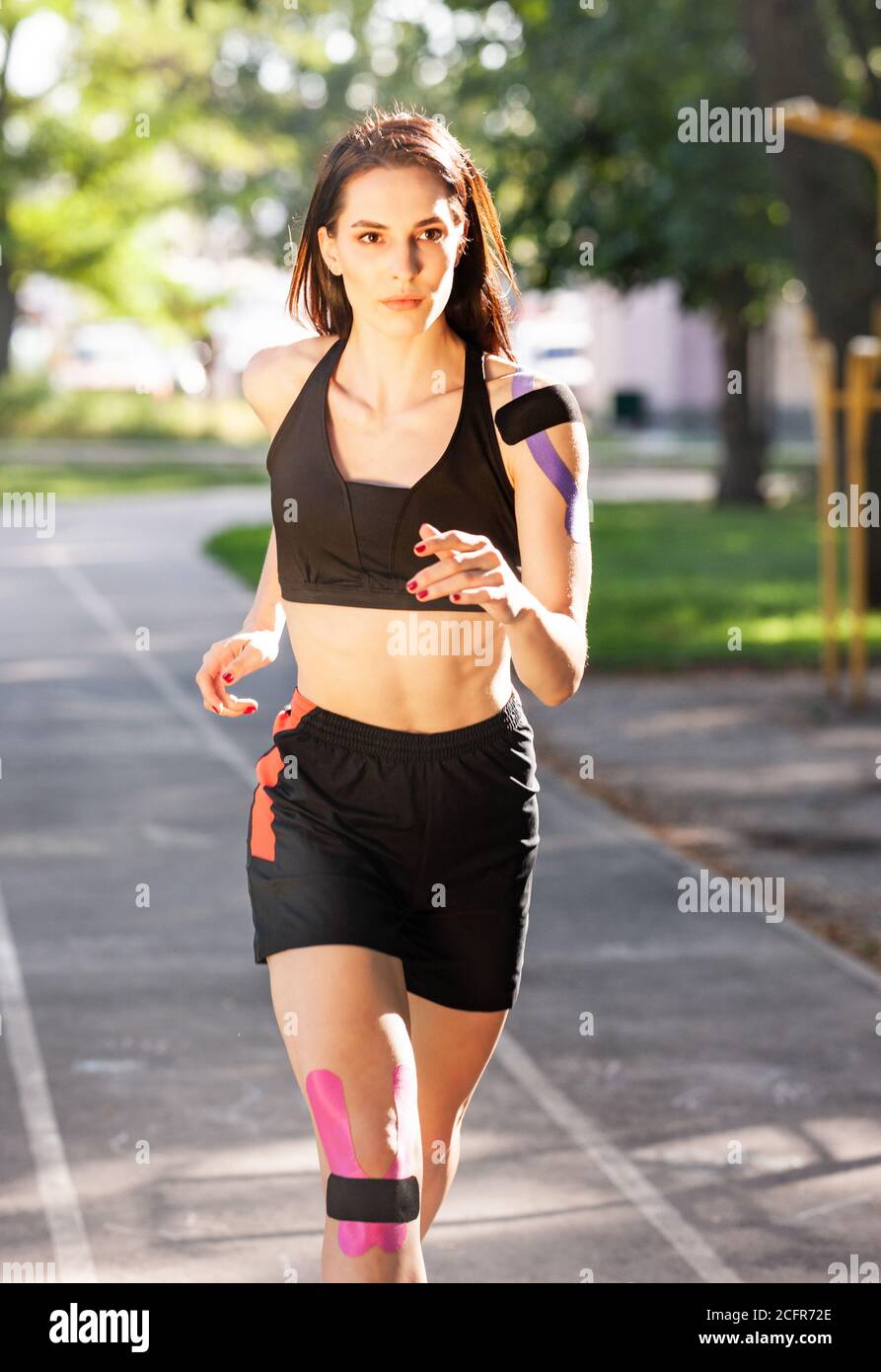 Front view of attractive young caucasian professional bodybuilder with ...