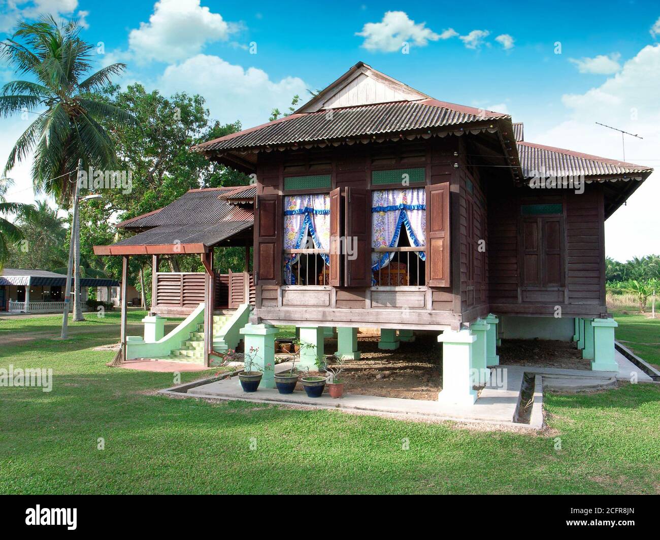 Traditional malay wooden house in village Stock Photo - Alamy