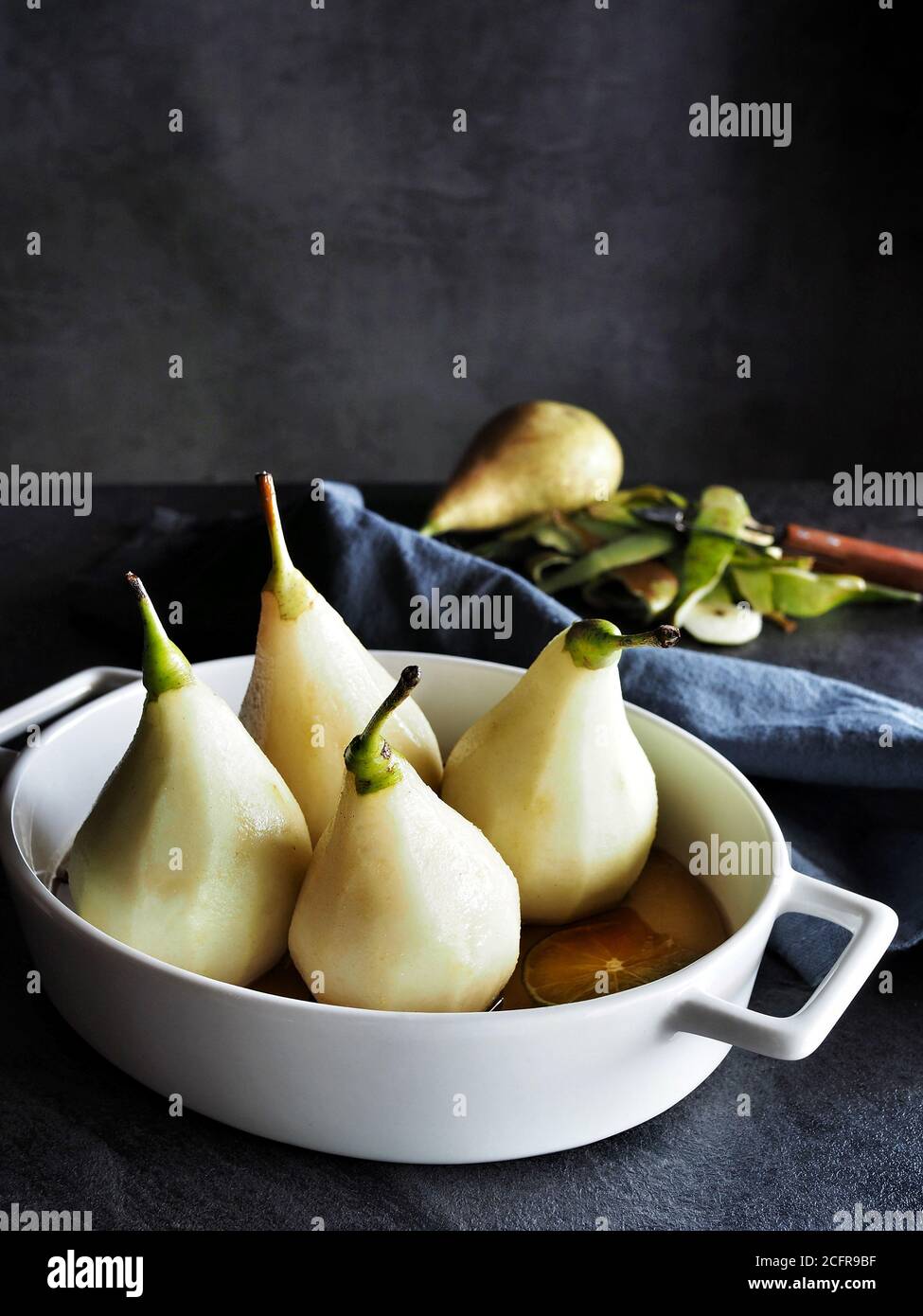 Four peeled pears ready to be roasted. Ingredients for recipe. Copy ...