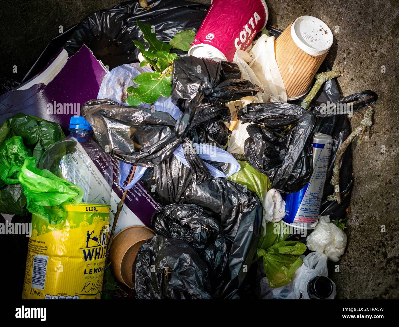 Bin full of Rubbish Stock Photo - Alamy