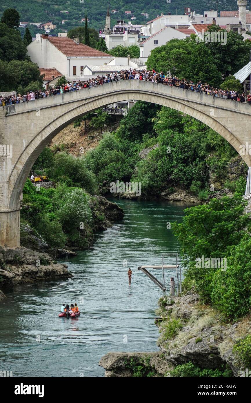Bosnia-Herzegovina: Mostar. Crowd of tourists on the famous bridge, in ...