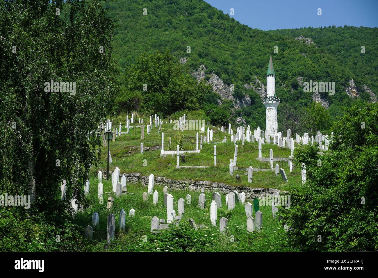 Bosnia-Herzegovina: Sarajevo. Moslem cemetery with tombs and minaret in ...