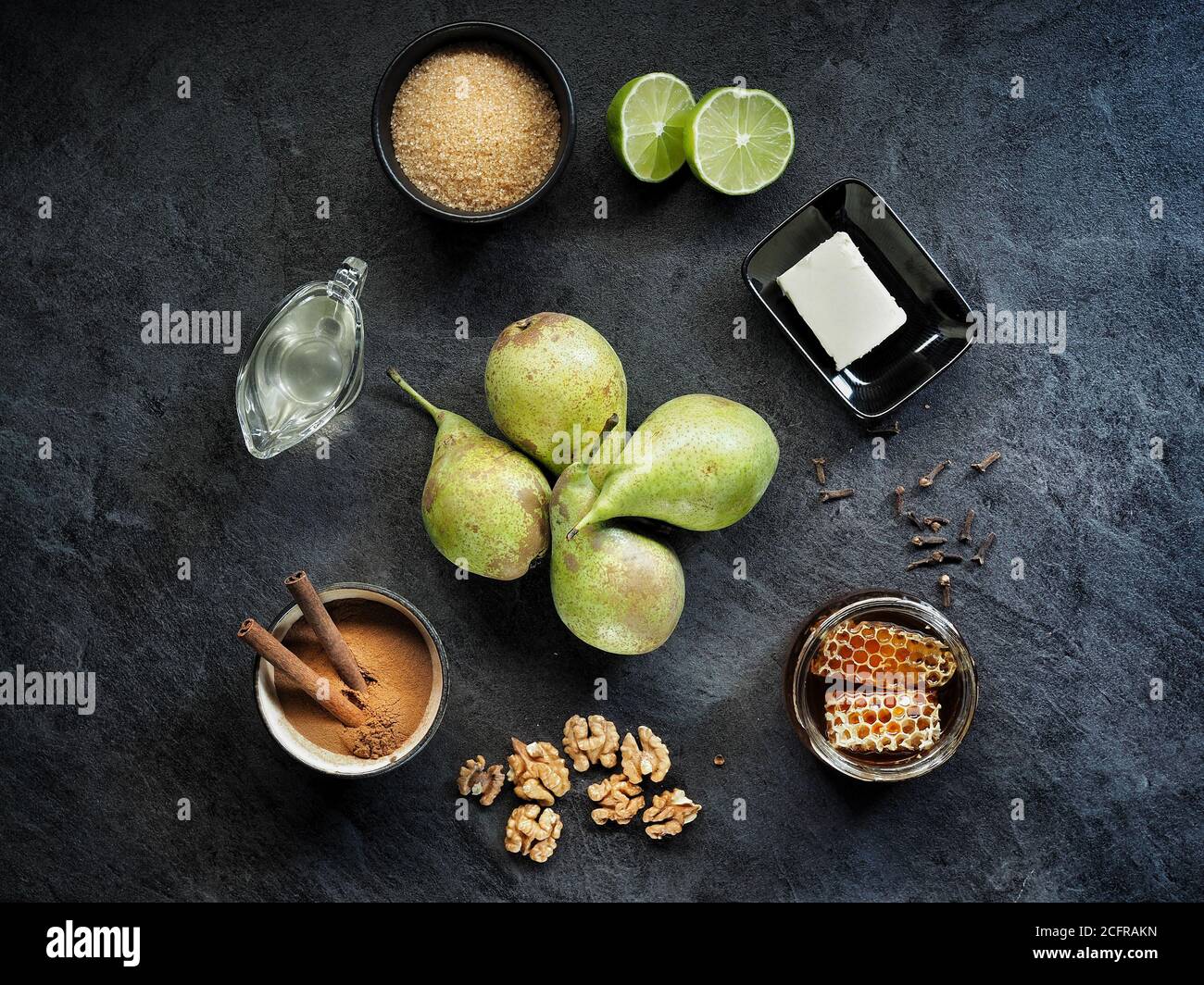 Roasted pears. Ingredients for recipe. Overhead view. Low key ...