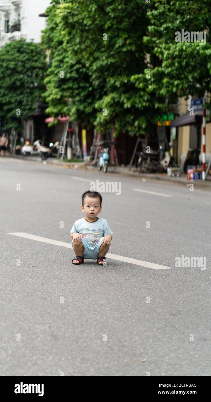 The Sitting Boy Stock Photo - Alamy