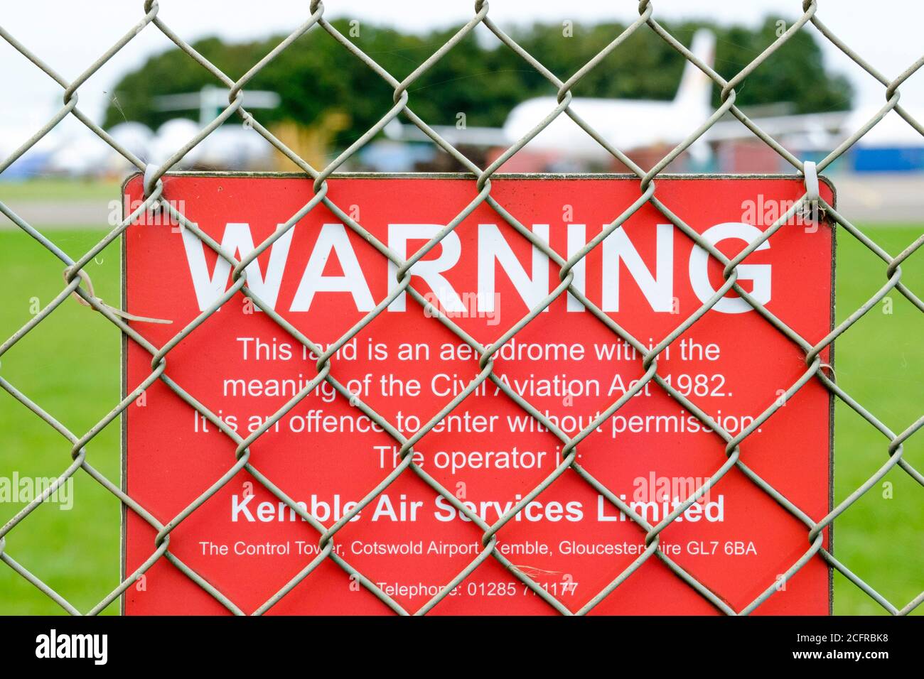 Warning sign on airport fence hi-res stock photography and images - Alamy