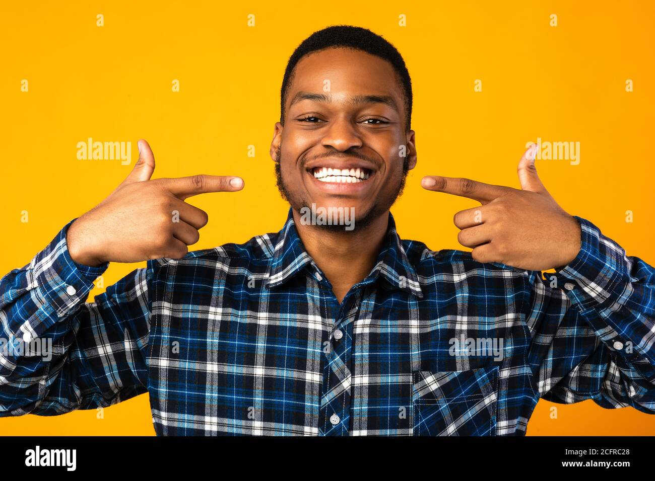 Portrait young black guy pointing hi-res stock photography and images ...