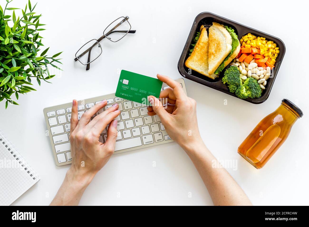 Woman using desktop app to order lunch with delivery Stock Photo - Alamy