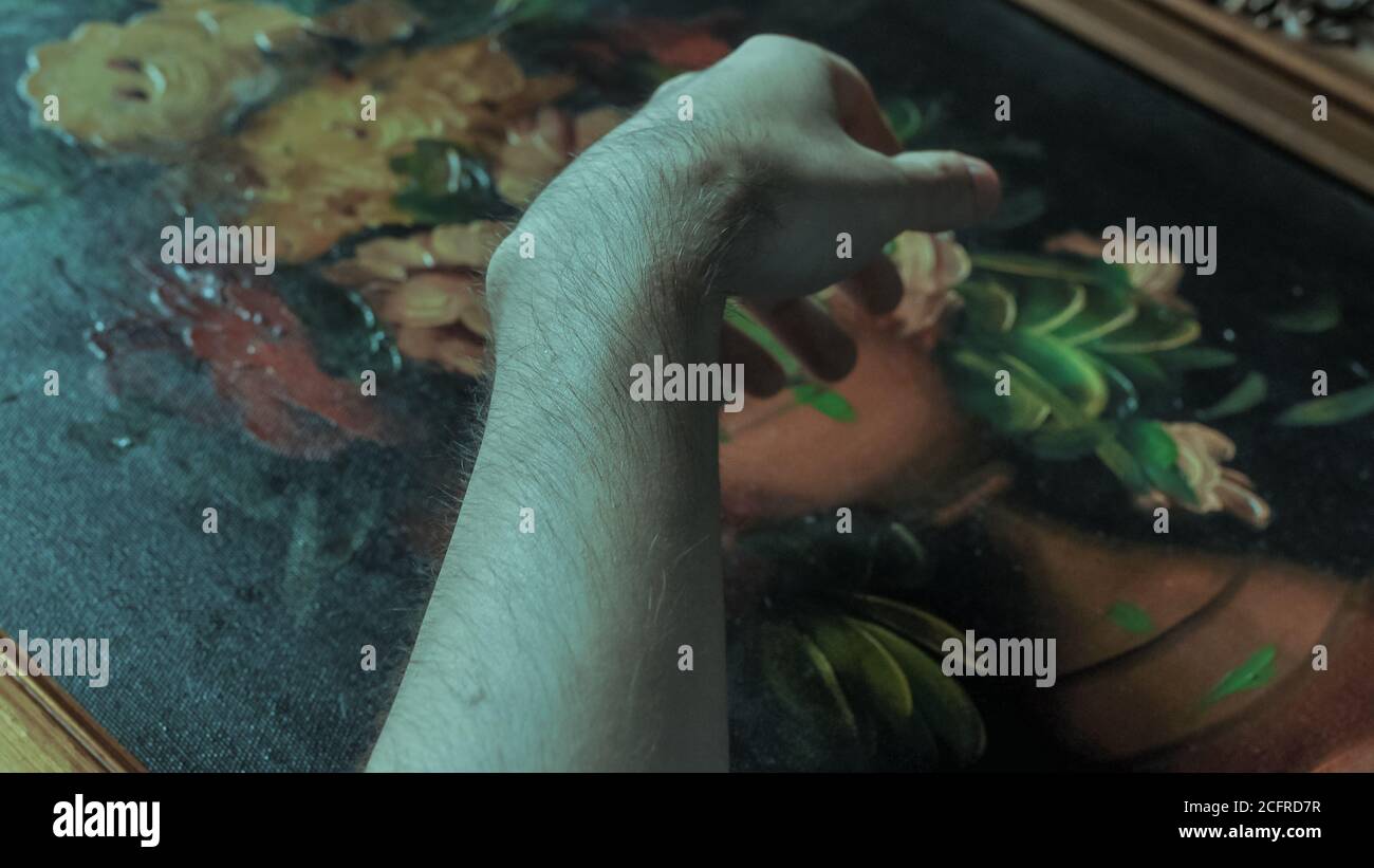 Hand and arm on painting flowers Stock Photo - Alamy