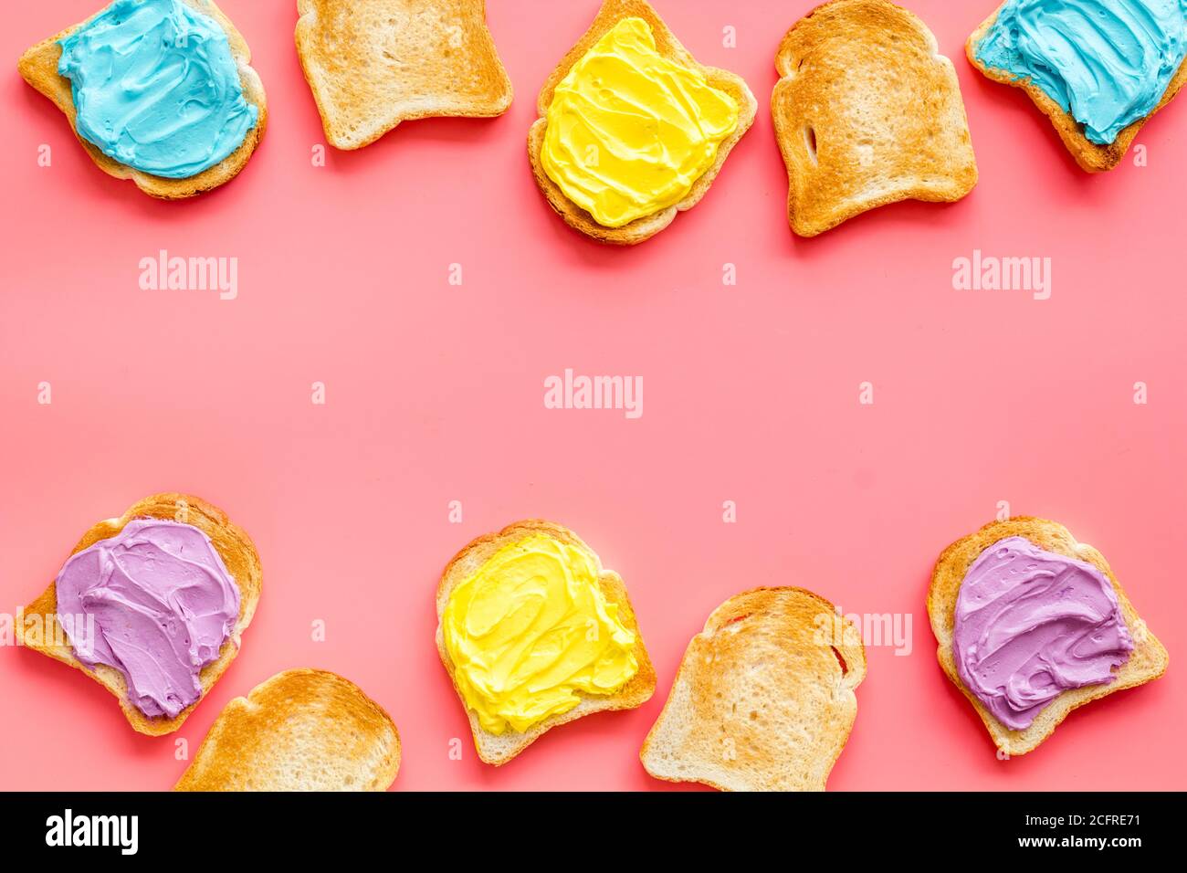 Layout of sandwiches with colored butter and cheese spread, top view ...
