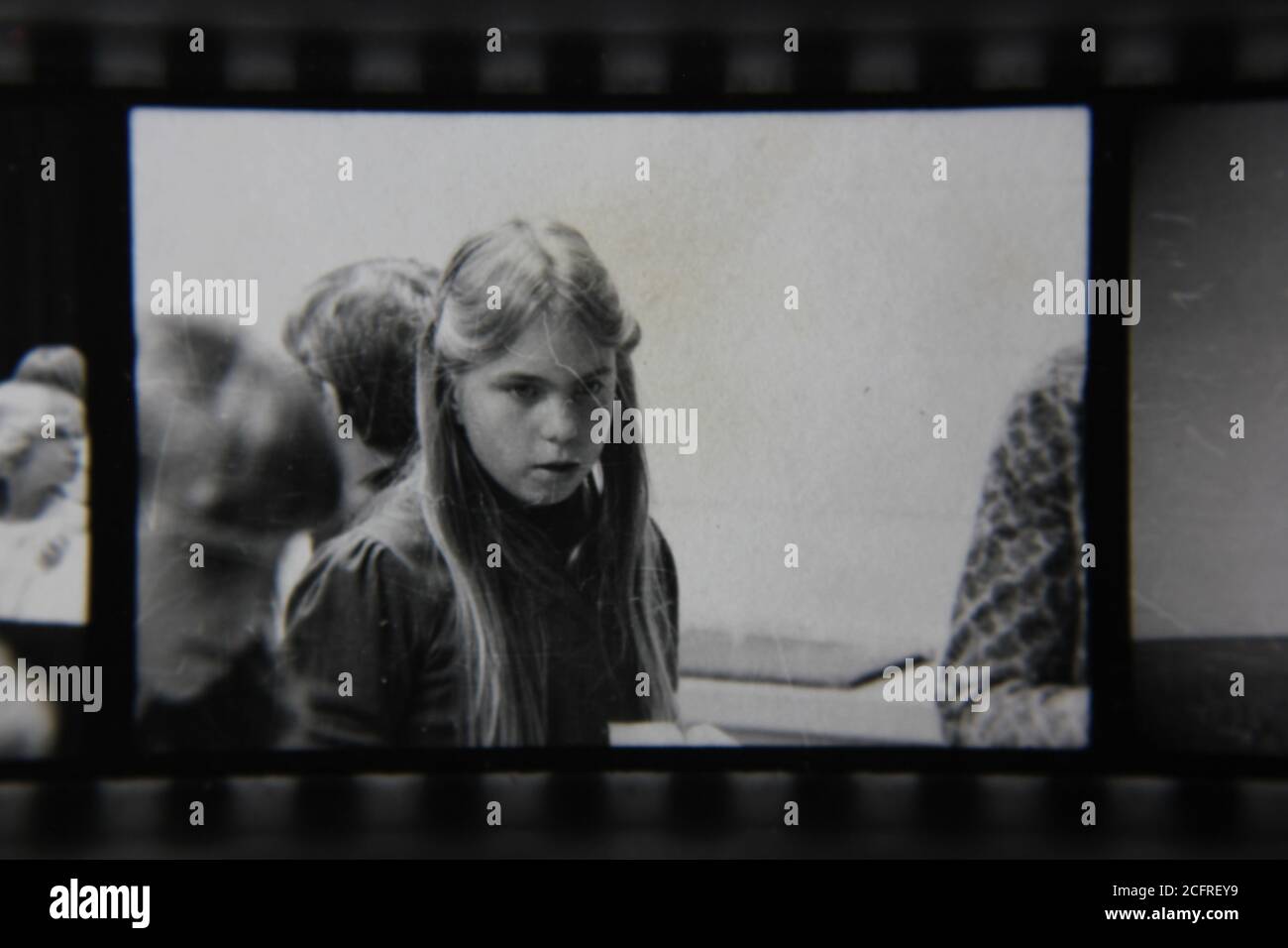 Fine 1970s vintage black and white photography of a young overwhelmed ...