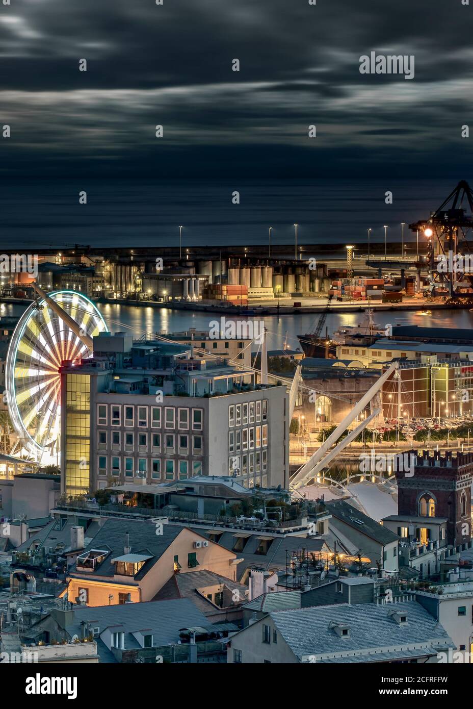 Aerial rooftop view of the Old Port in Genoa, Italy at night with the ...