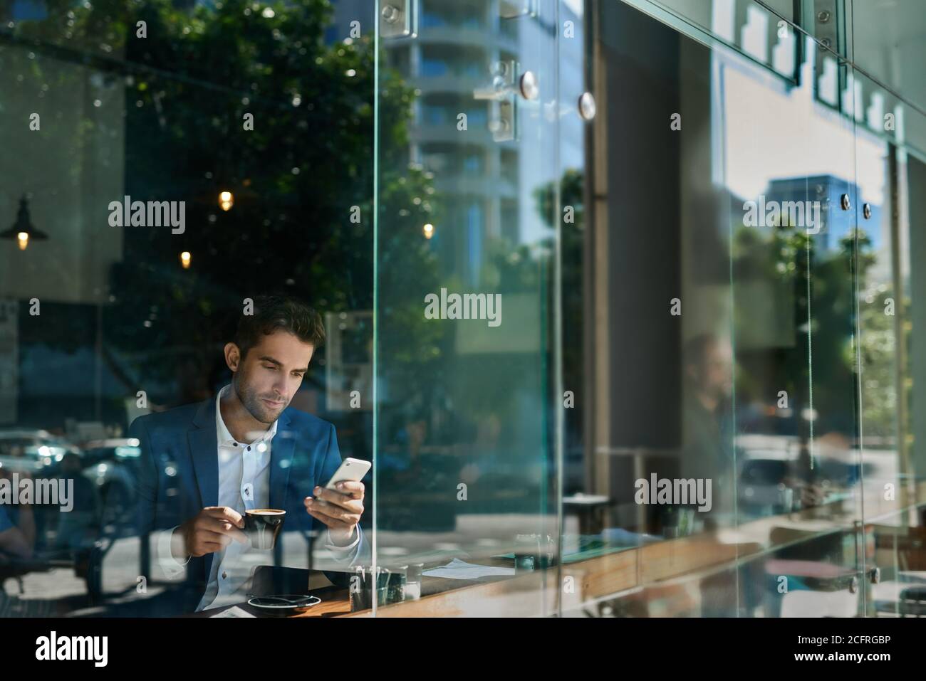 Young man checking text messages hi-res stock photography and images ...