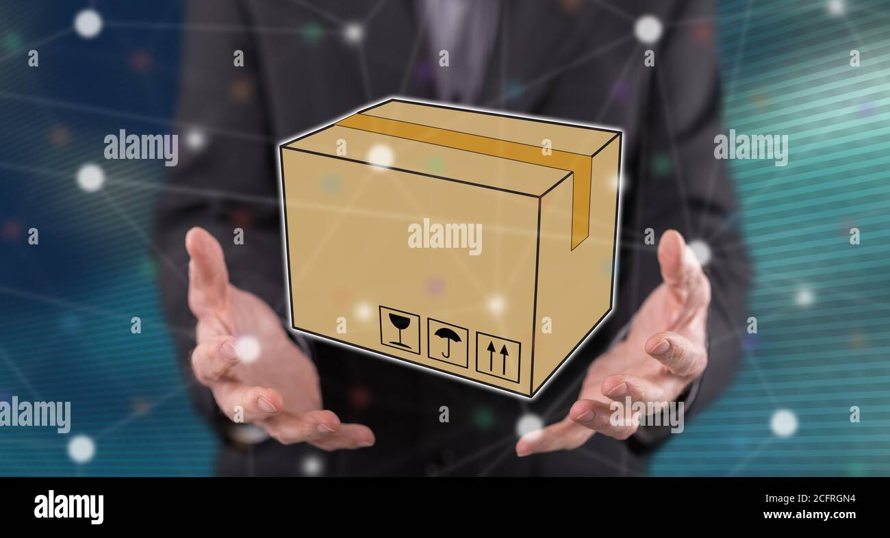 Packaging concept above the hands of a man in background Stock Photo ...