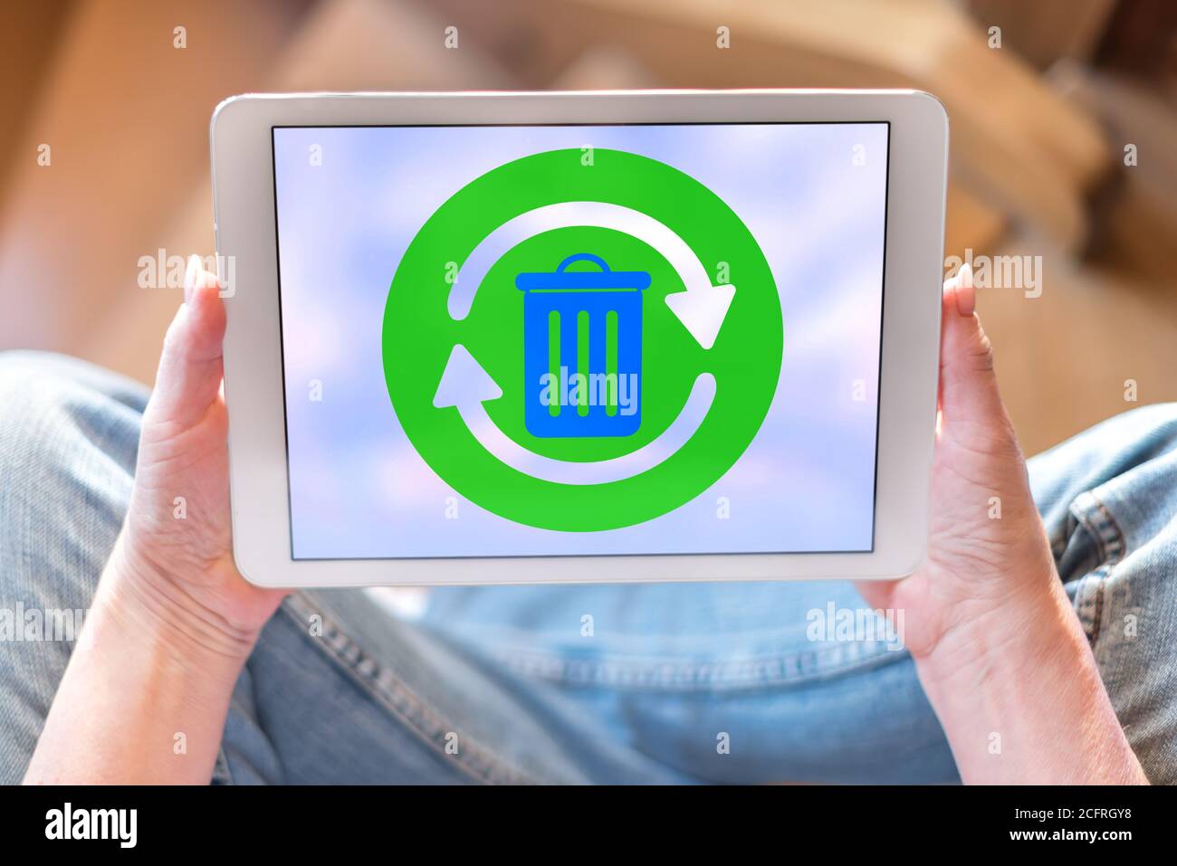 Tablet screen displaying a recycling concept Stock Photo - Alamy