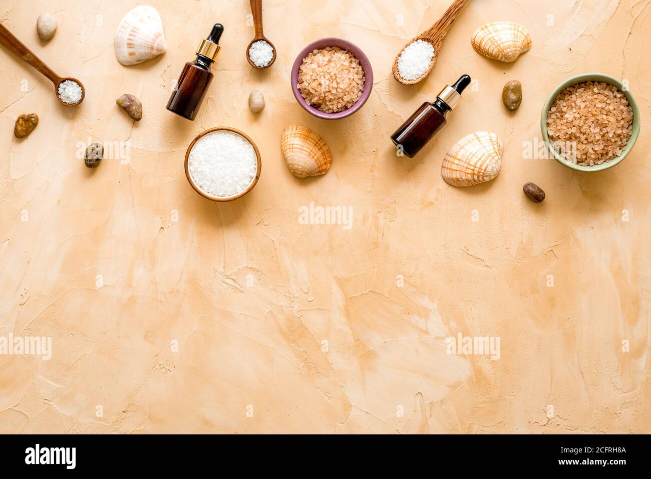Frame of sea spa salt in bowl and bath set top view Stock Photo - Alamy