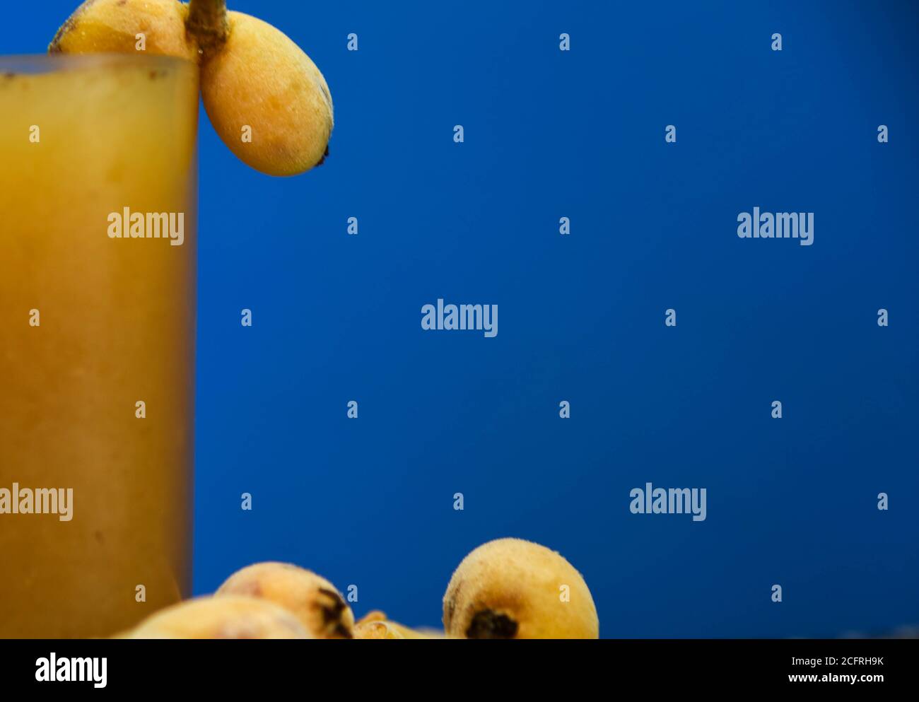 Loquat and fruit juice (Eriobotrya japonica). The loquat is a small ...