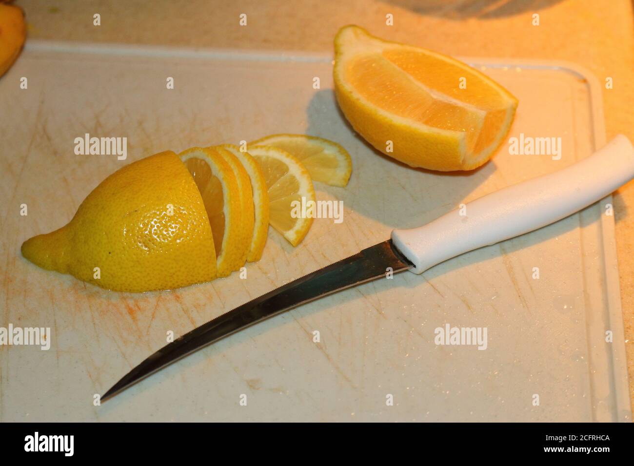 Still life with lemon and knife Stock Photo - Alamy