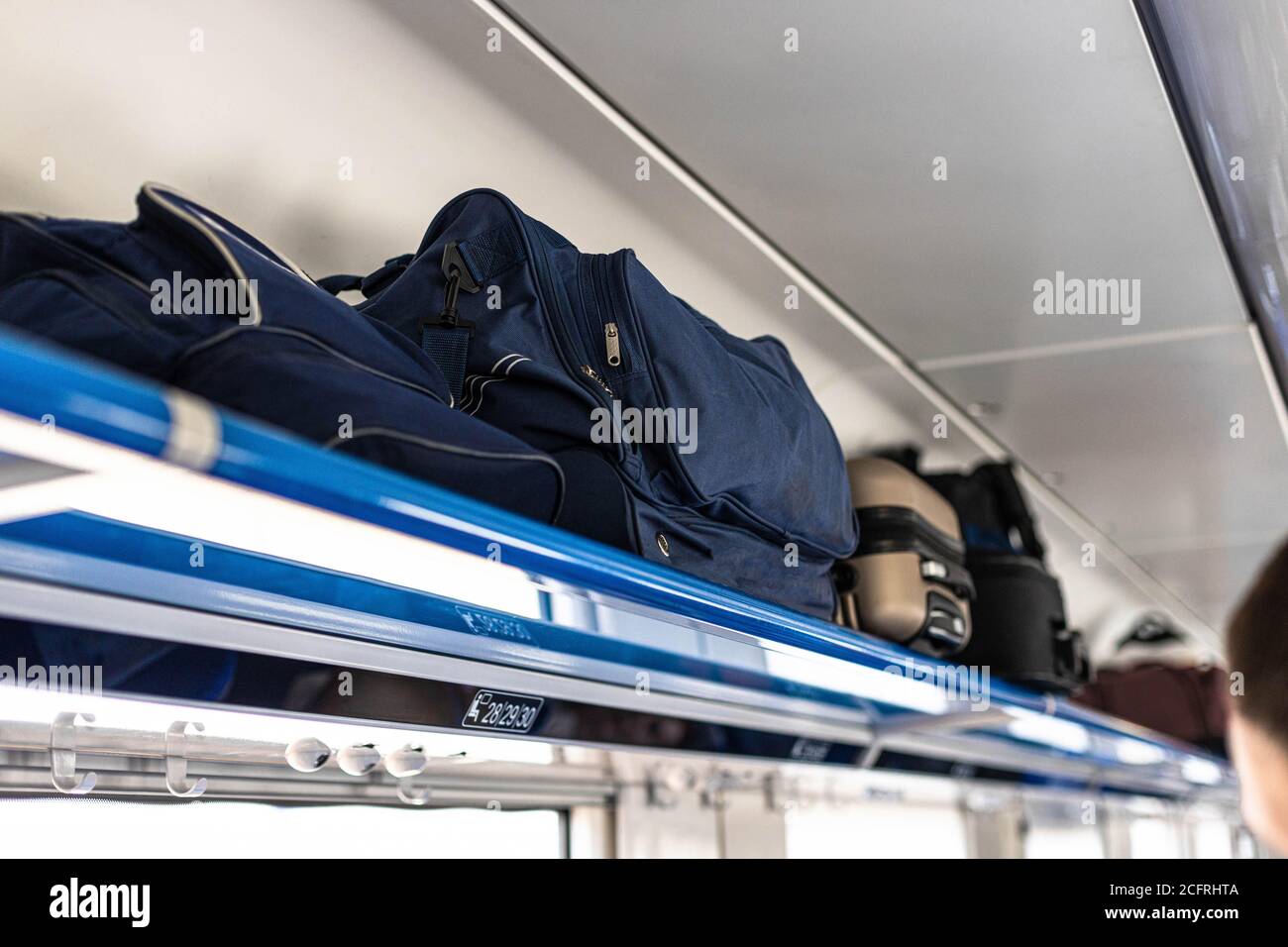 Luggage on shelf railway train. Holiday vacation, tourism, travel ...