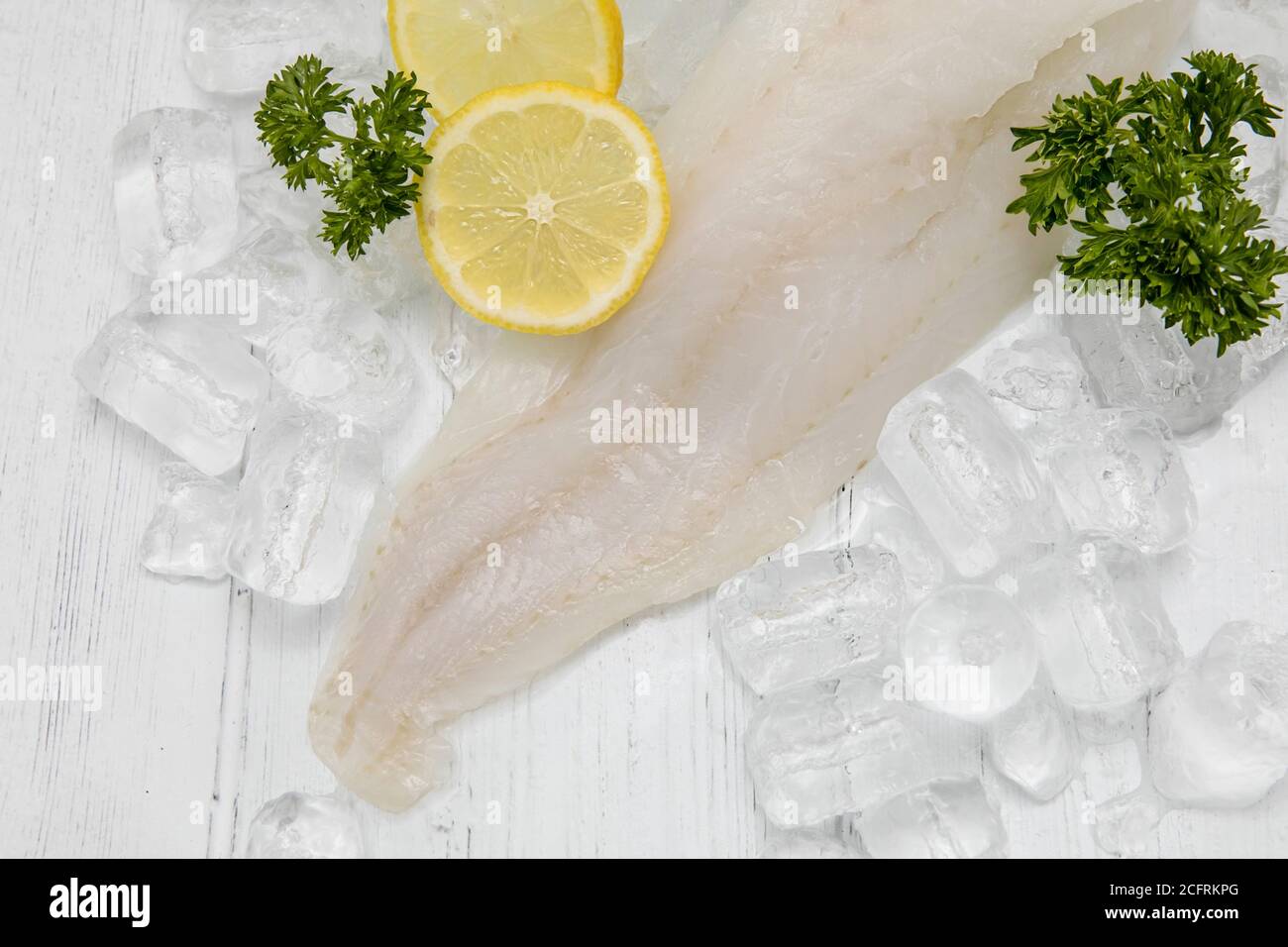 Raw white fish on ice Stock Photo - Alamy