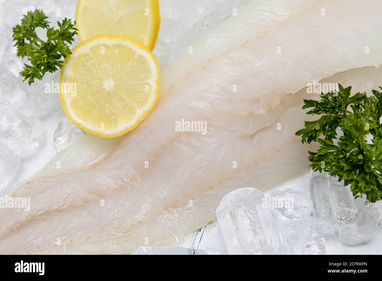 Raw white fish on ice Stock Photo - Alamy