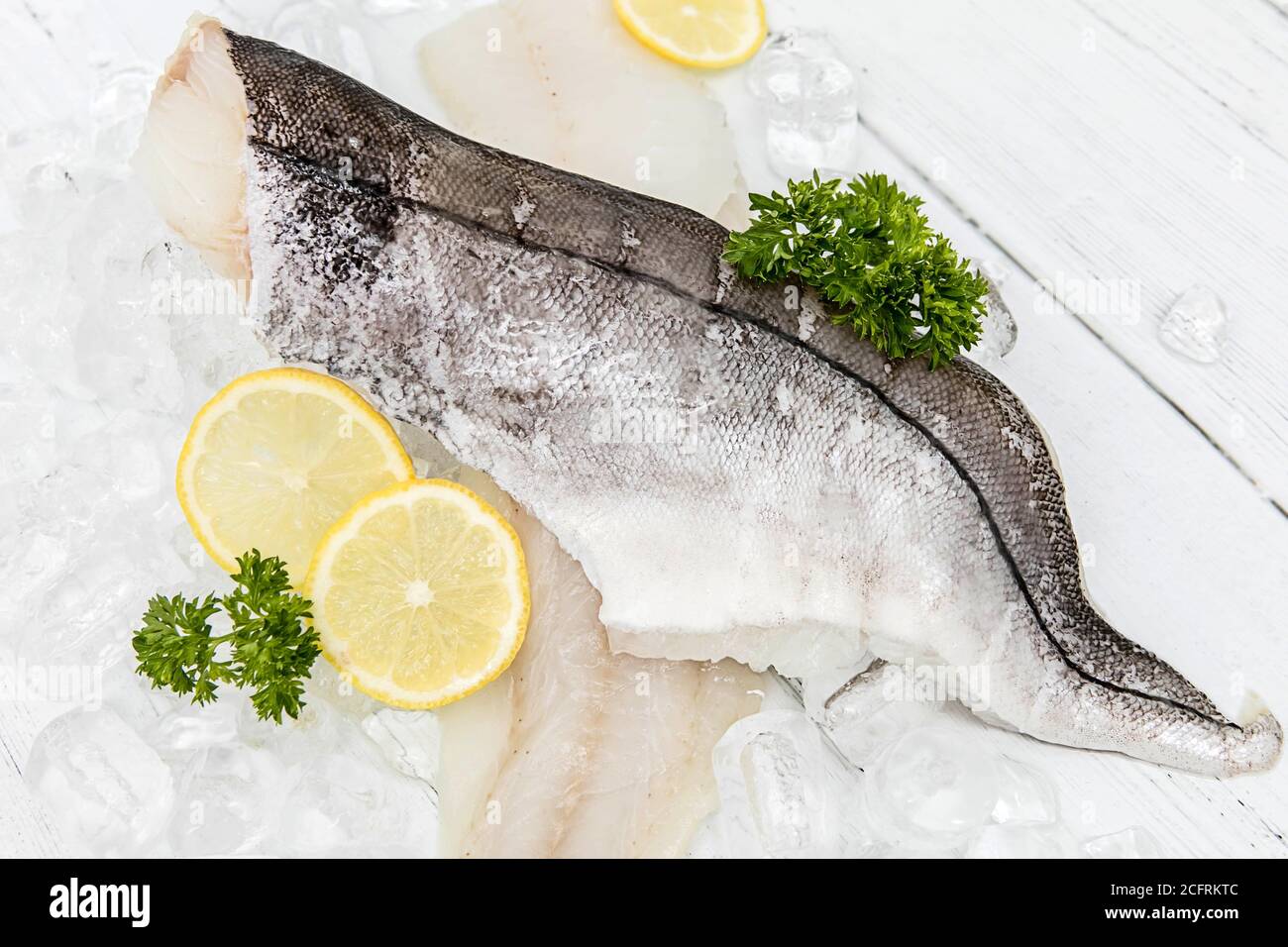 Raw white fish on ice Stock Photo - Alamy