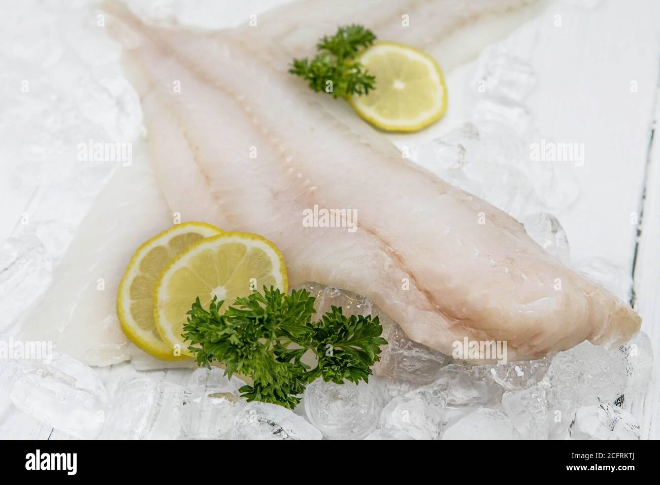 Raw white fish on ice Stock Photo - Alamy
