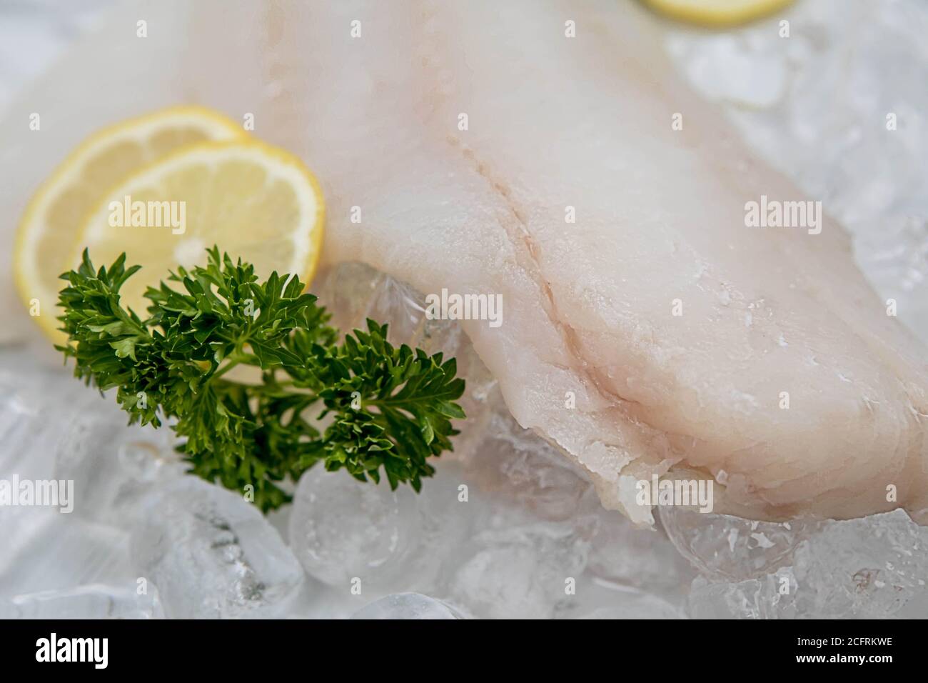 Raw white fish on ice Stock Photo - Alamy