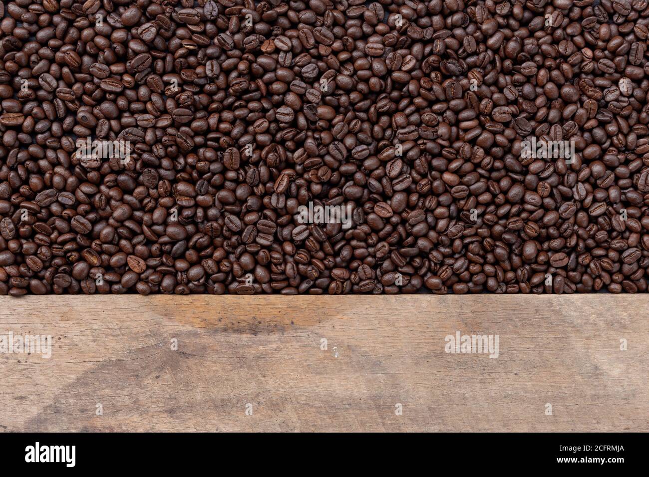 coffee bean on wooden background. top view Stock Photo - Alamy