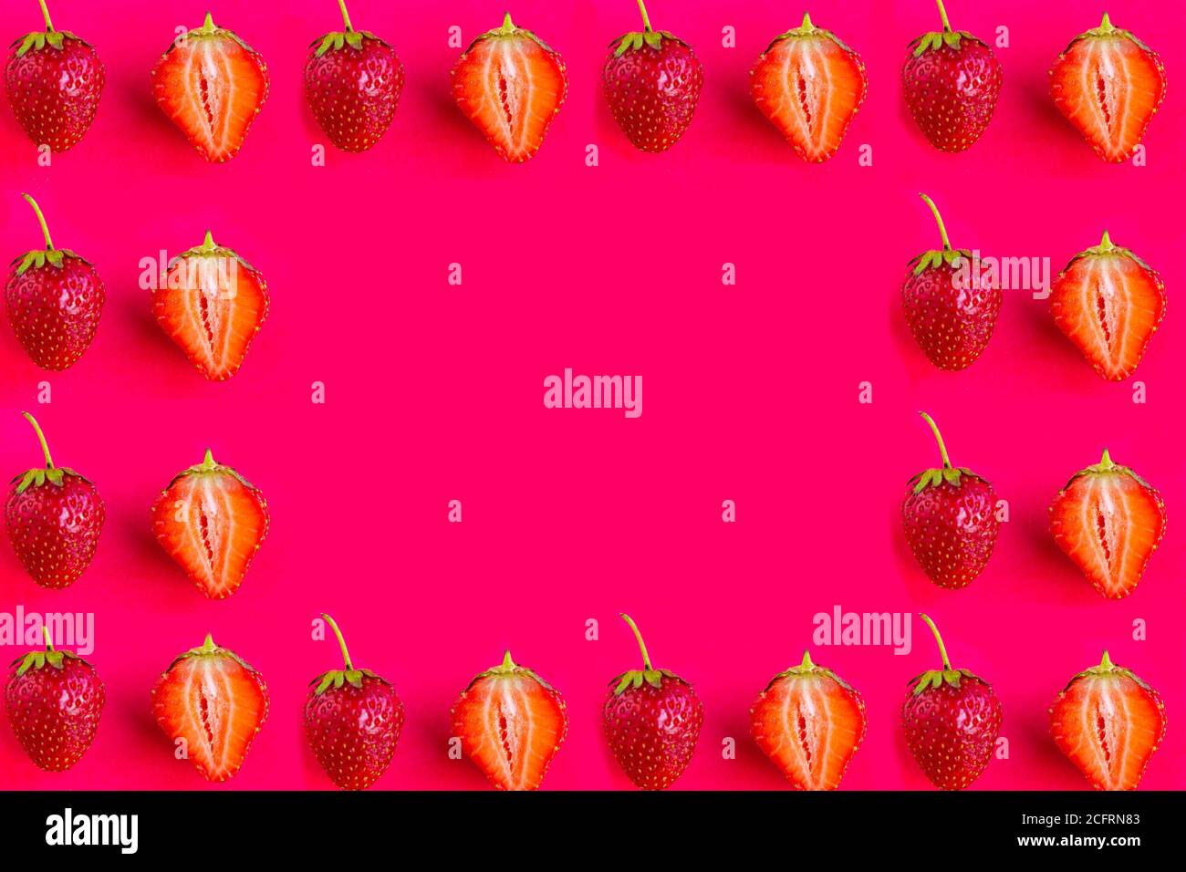 Strawberry frame pattern on dark red background, minimal concept Stock ...