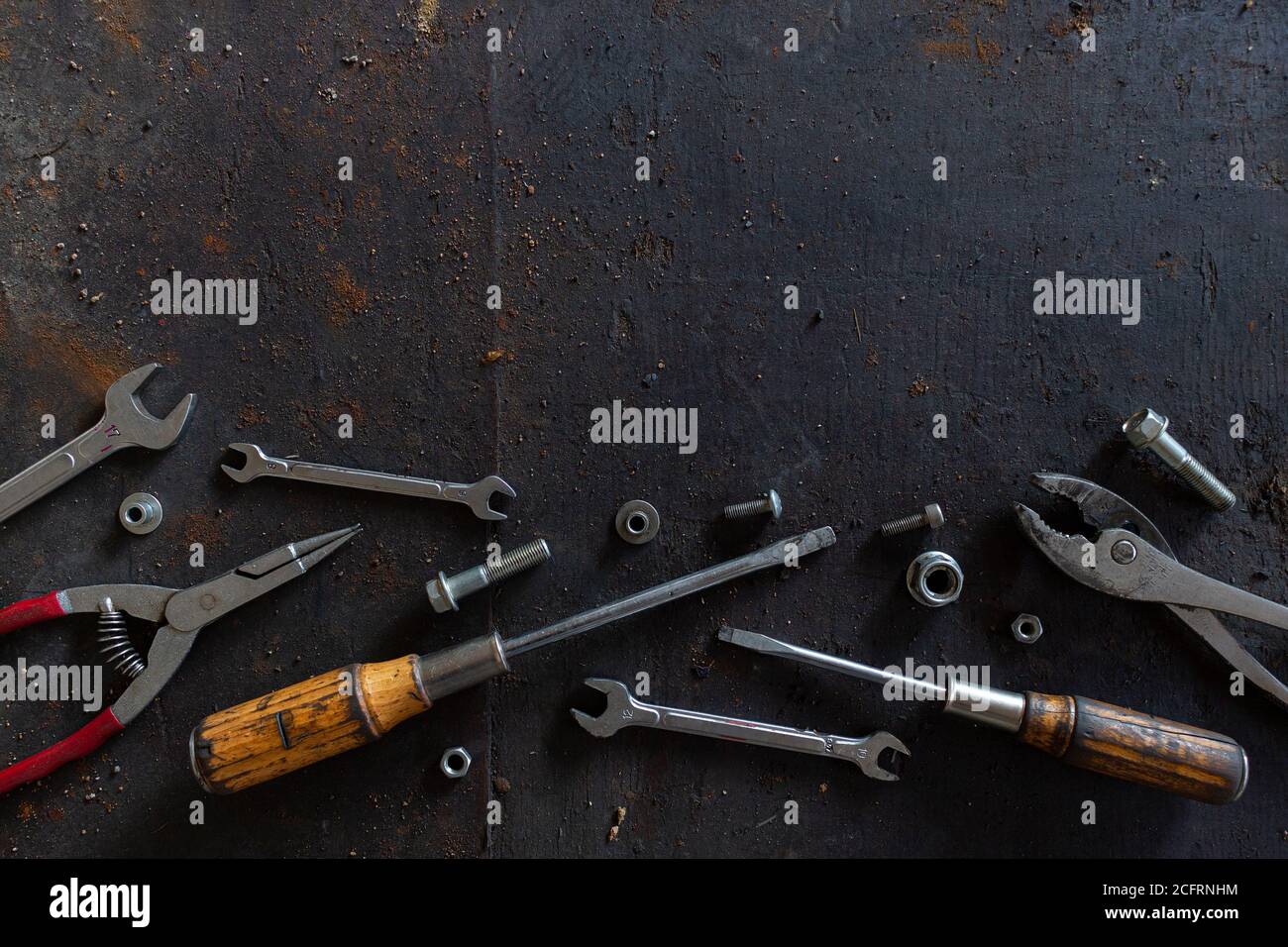 old tools on black wooden floor background Stock Photo - Alamy